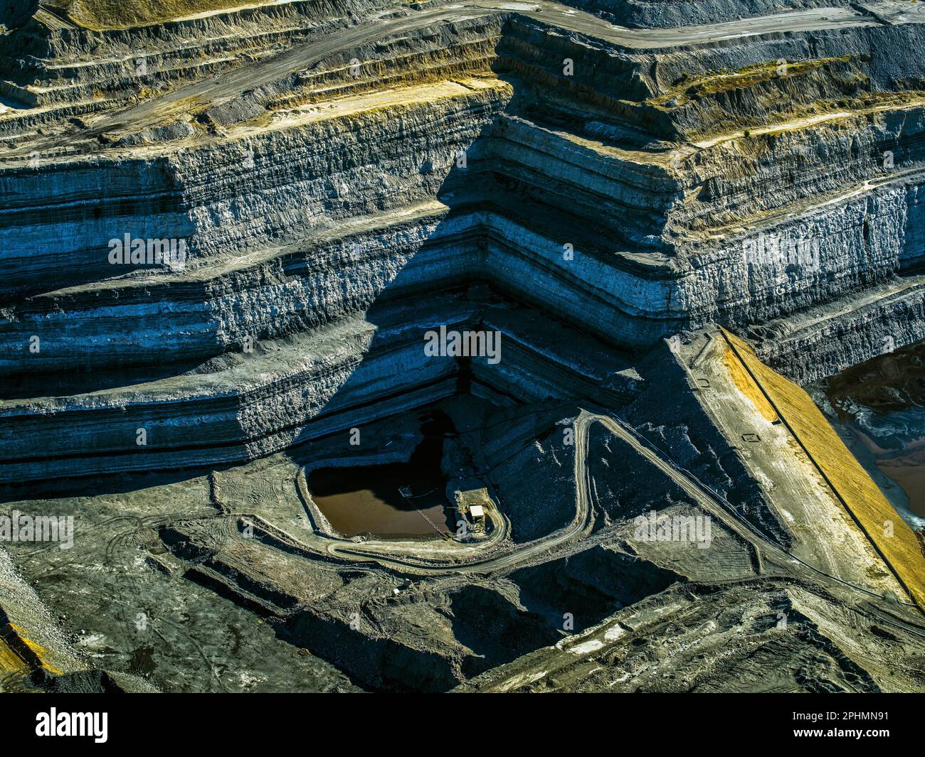 A large industrial quarry with a pool of water used for coaling and ...