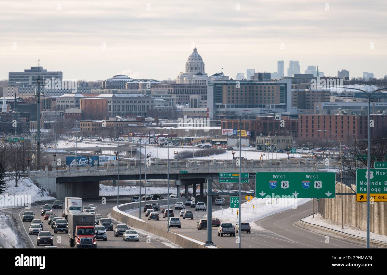 A highway with an overpass, cars driving along the long stretch of road ...
