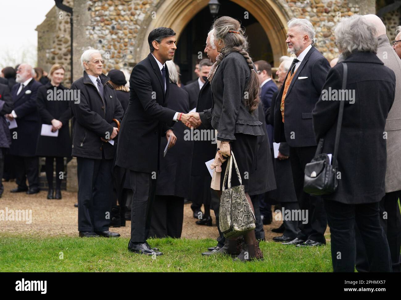 Prime Minister Rishi Sunak (centre) following the funeral of former ...