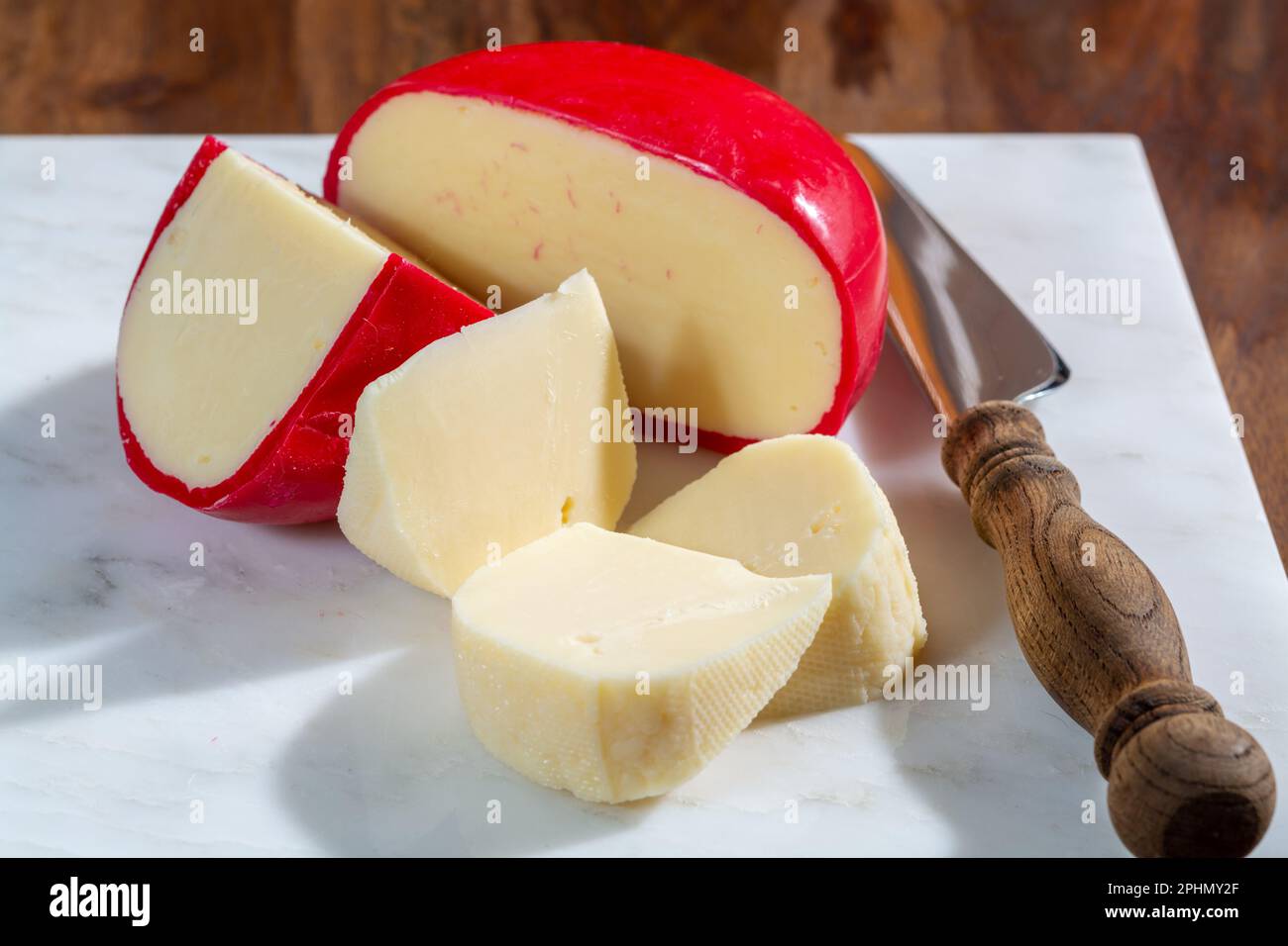 British red waxed original cheddar cheese madse from cow milk close up ...