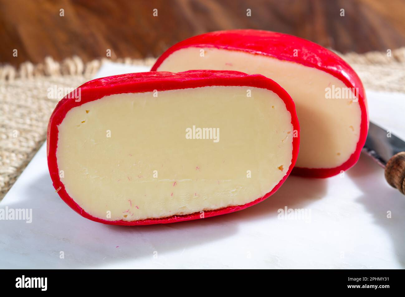 British red waxed original cheddar cheese madse from cow milk close up ...