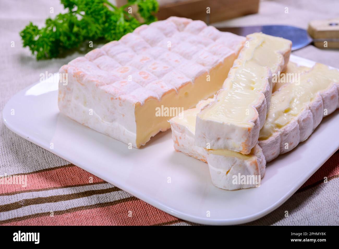 French cheeses collection, yellow Vieux Pane cheese with white mold ...