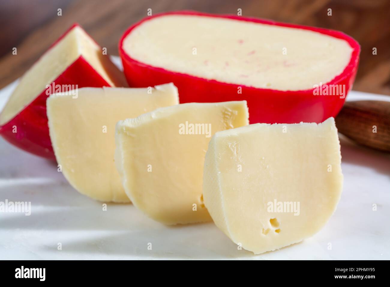 British red waxed original cheddar cheese madse from cow milk close up ...