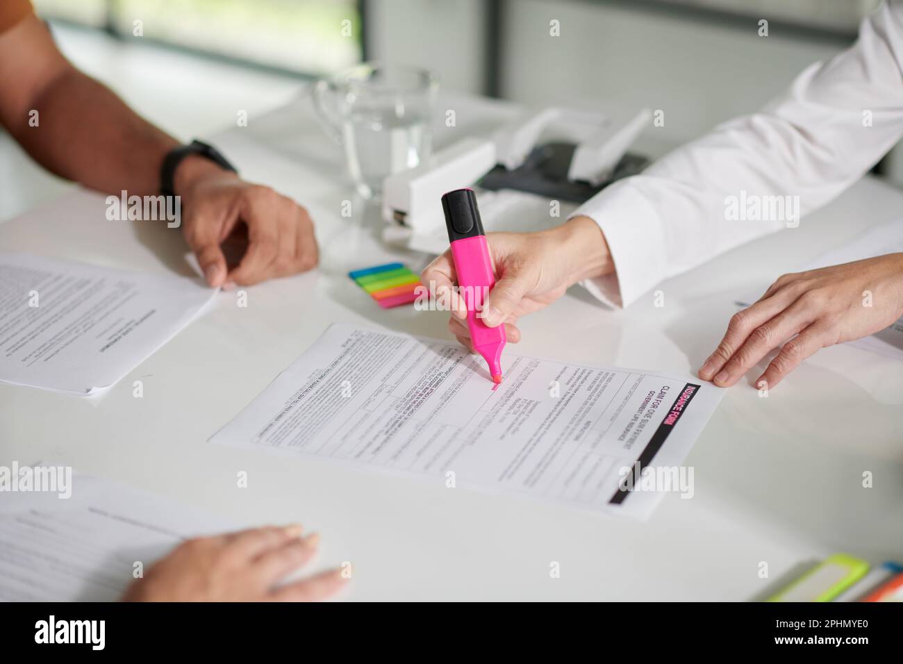 Manager highlighting important part of document with pink color Stock ...