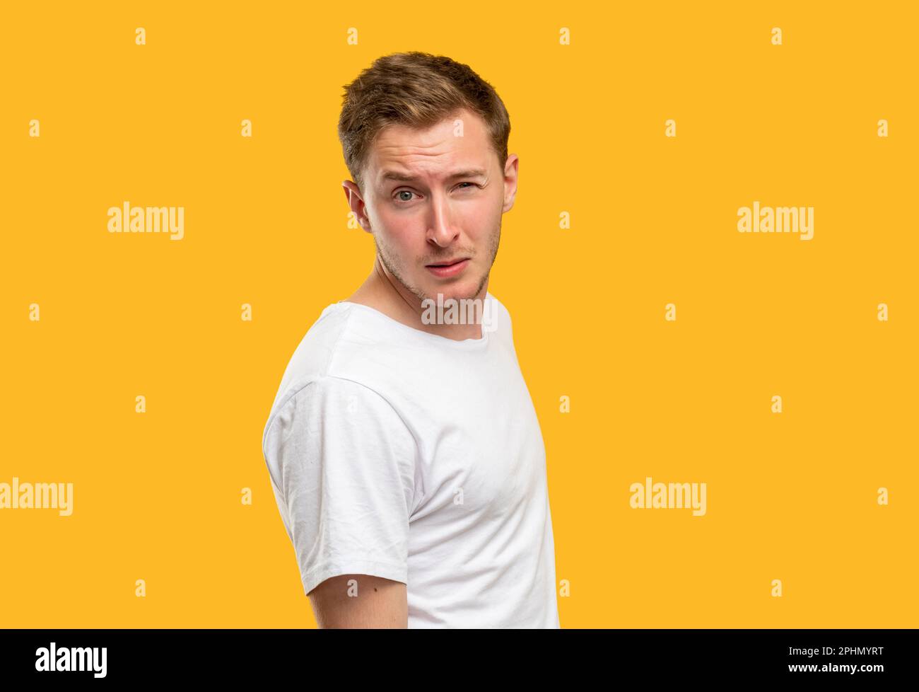 Man with suspicious look yellow hi-res stock photography and images - Alamy