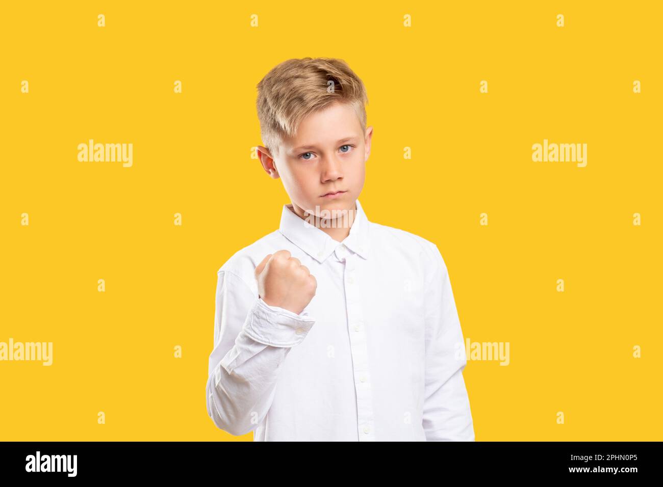 angry boy portrait threat power kid warning fist Stock Photo - Alamy