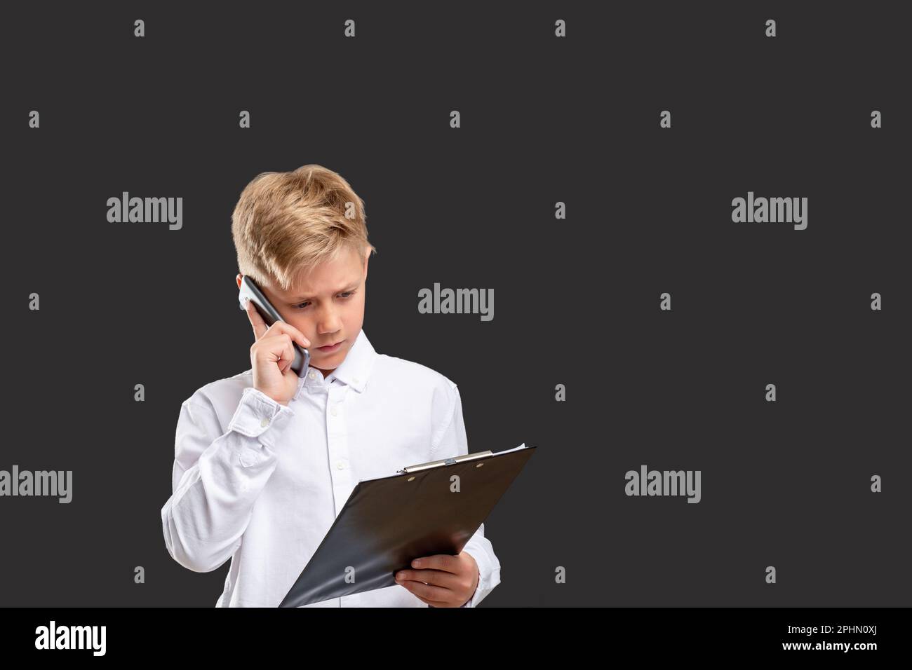 children business smart boy working project phone Stock Photo - Alamy