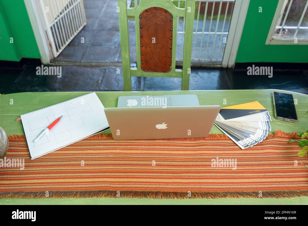 workspace, home office with a laptop, phone, color palette swatch and ...