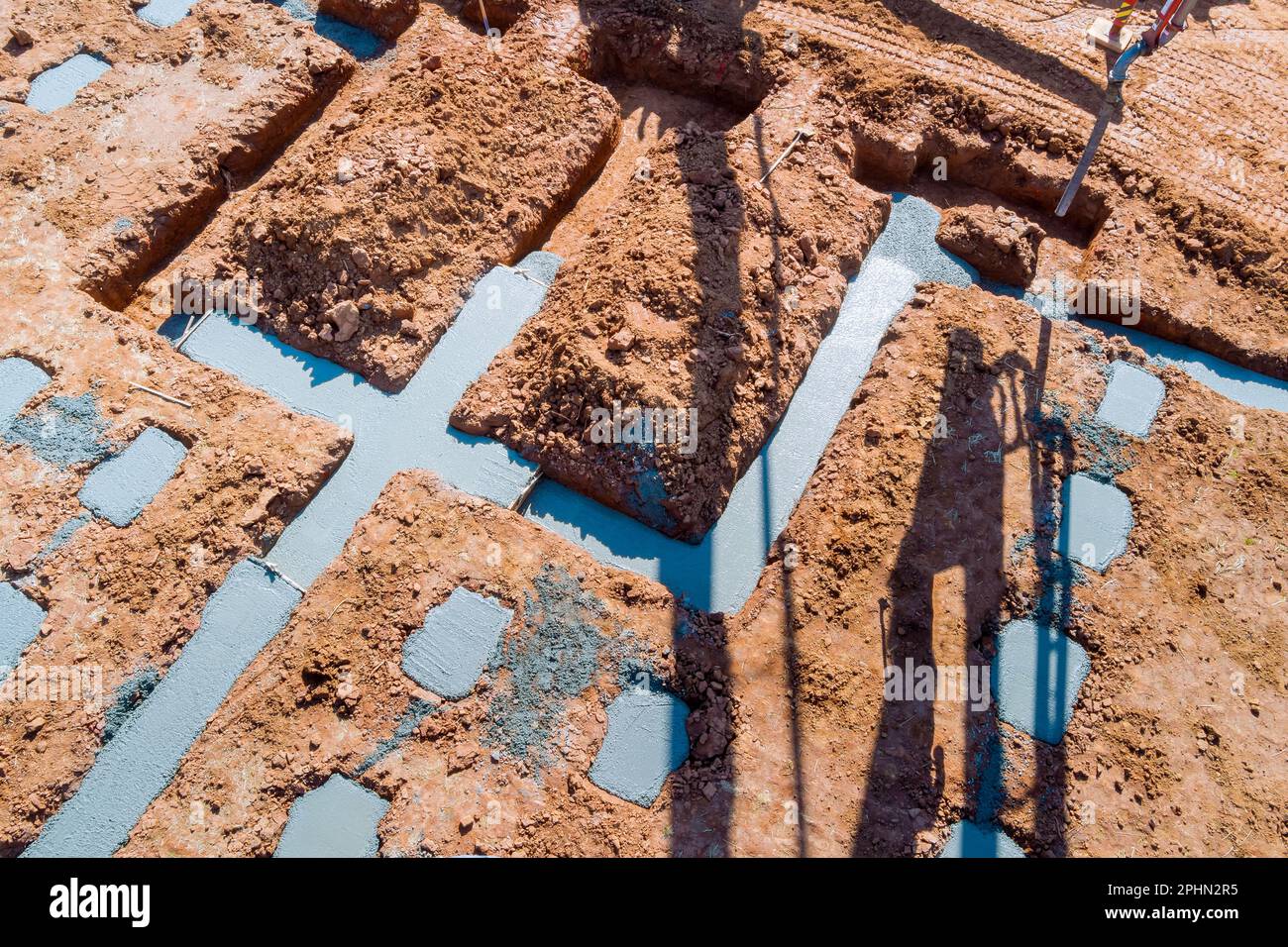 When constructing house foundations are poured using an automatic pump ...