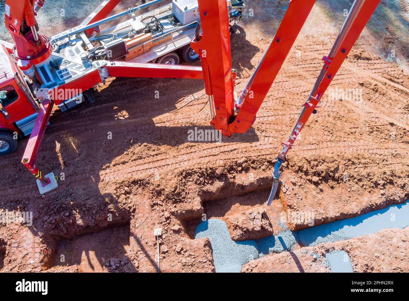 An automatic pump is used to direct cement concrete in construction ...