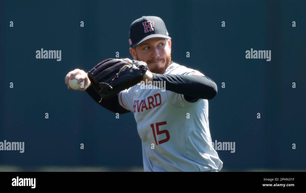Harvard infielder Jake Berger makes a a play against Penn during an ...