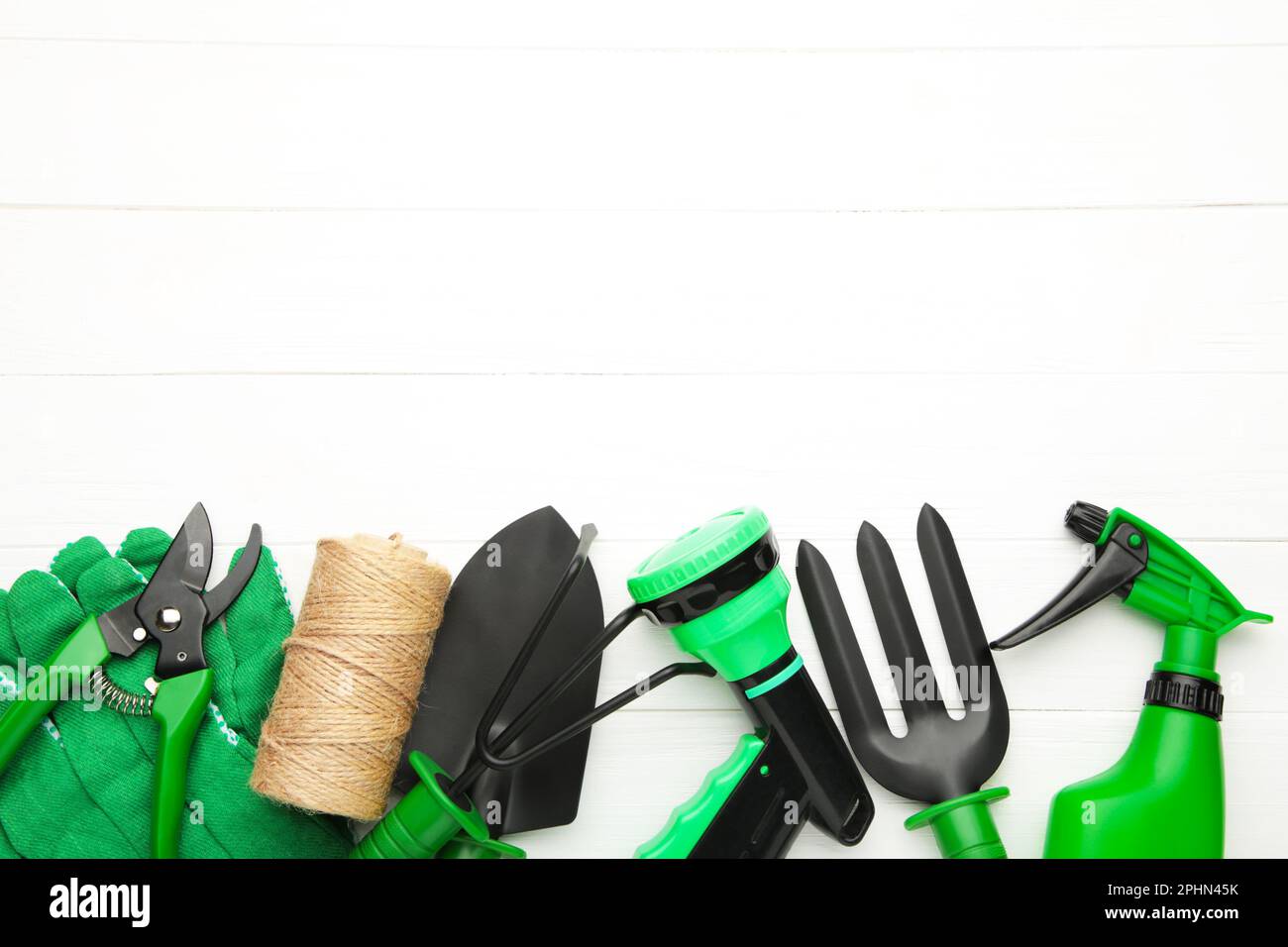 Gardening tools on white wooden background with copy space. Spring ...