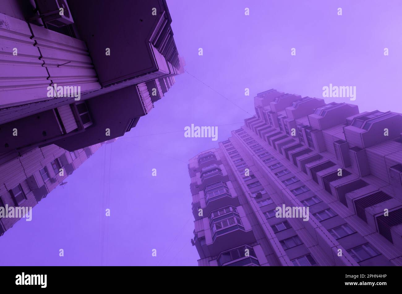 Tall residential buildings in the form of a tower, immersed in a misty ...