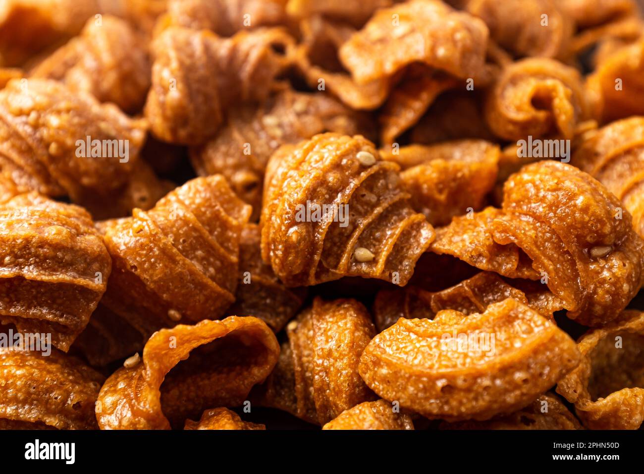 Sweet and crunchy conch-shaped snacks Stock Photo - Alamy