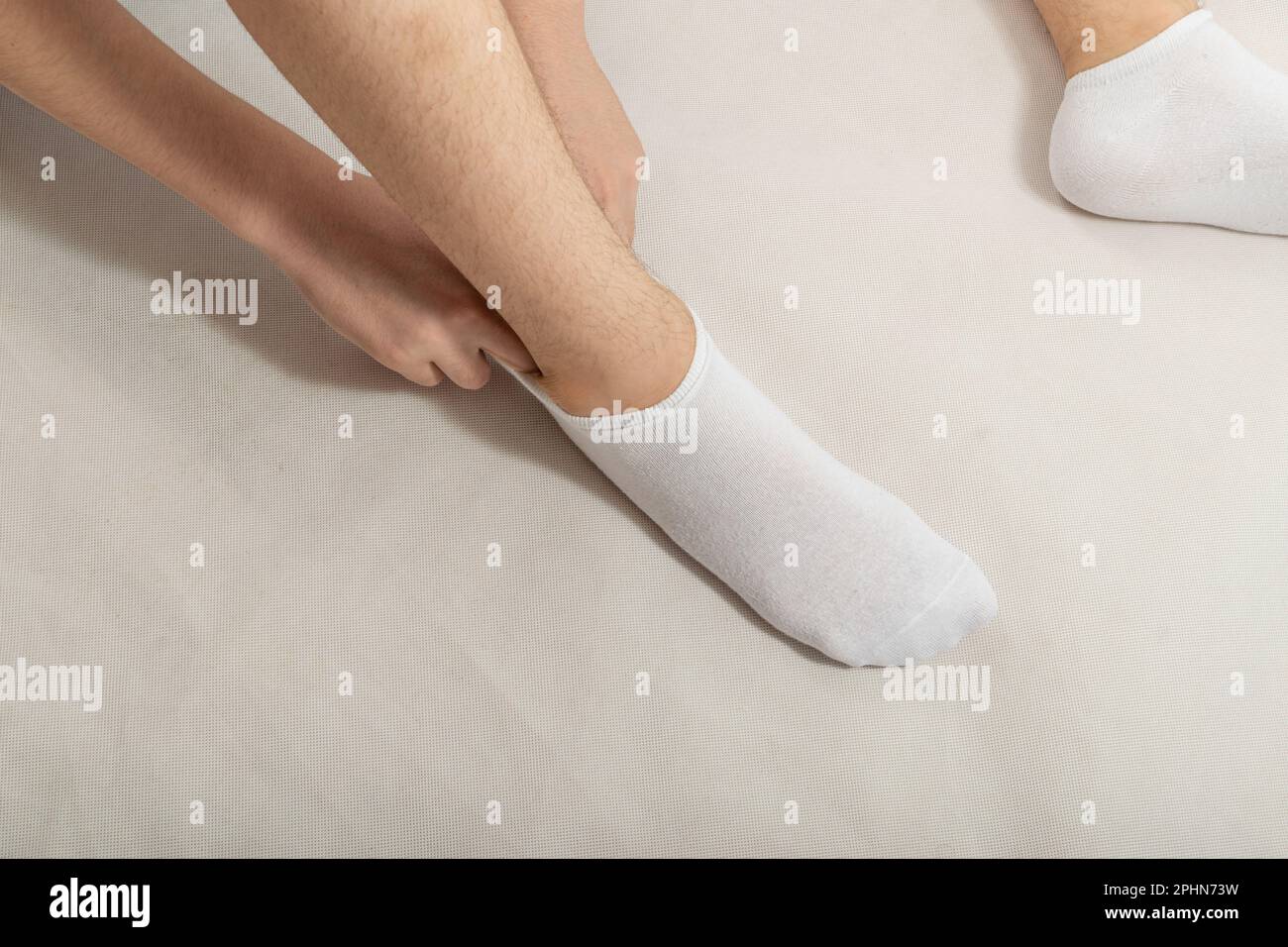 Boy Puts on White Socks, Man Putting Sock in Cold Winter or Take It off ...