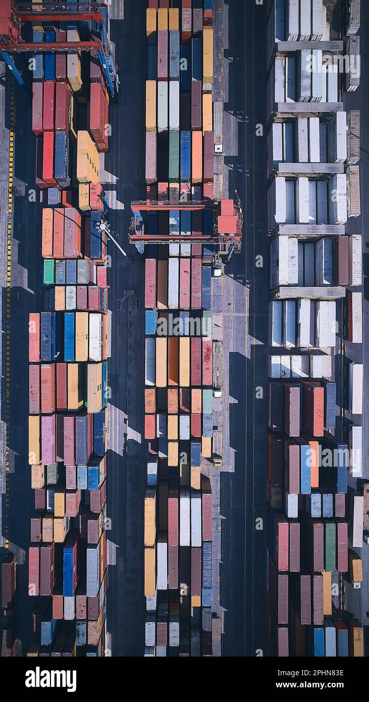 Stacked cargo containers top down aerial view. Containers at logistics terminal. Cargo container ...