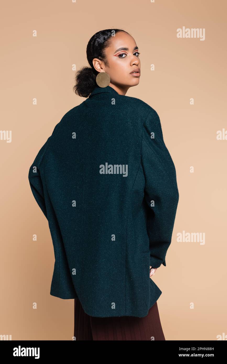 stylish african american model in dark blue oversized blazer posing ...