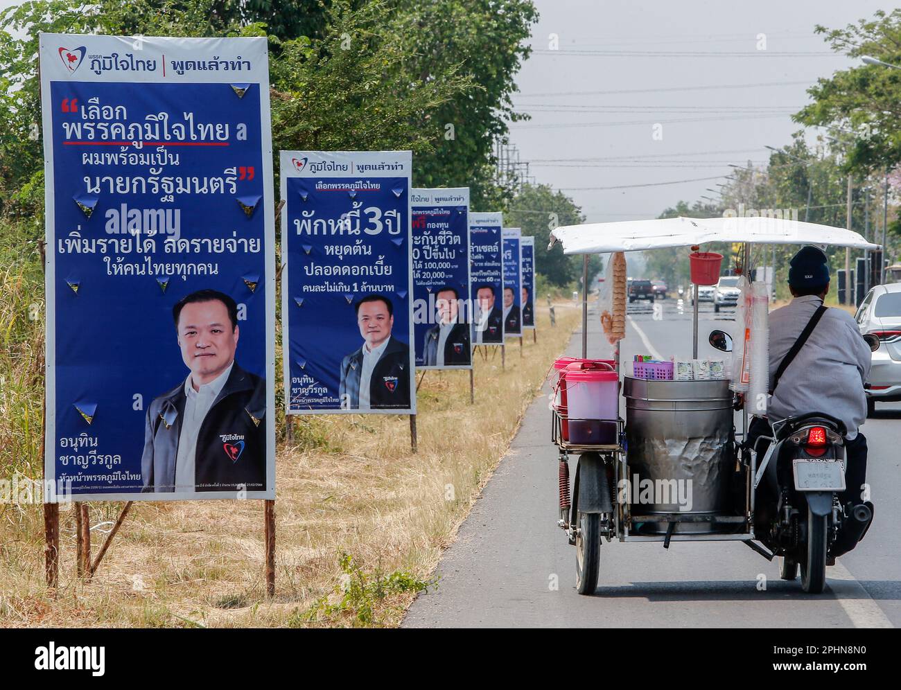 Nakhon Sawan, Thailand. 29th Mar, 2023. A person rides a bicycle past ...