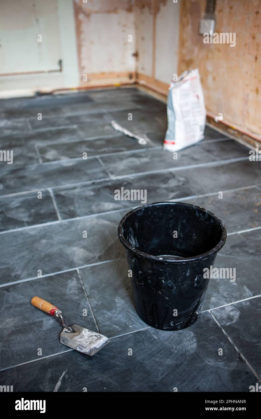 Kitchen Fitters: Stone Floor Tiles. Bucket, water, trowel and grout ...