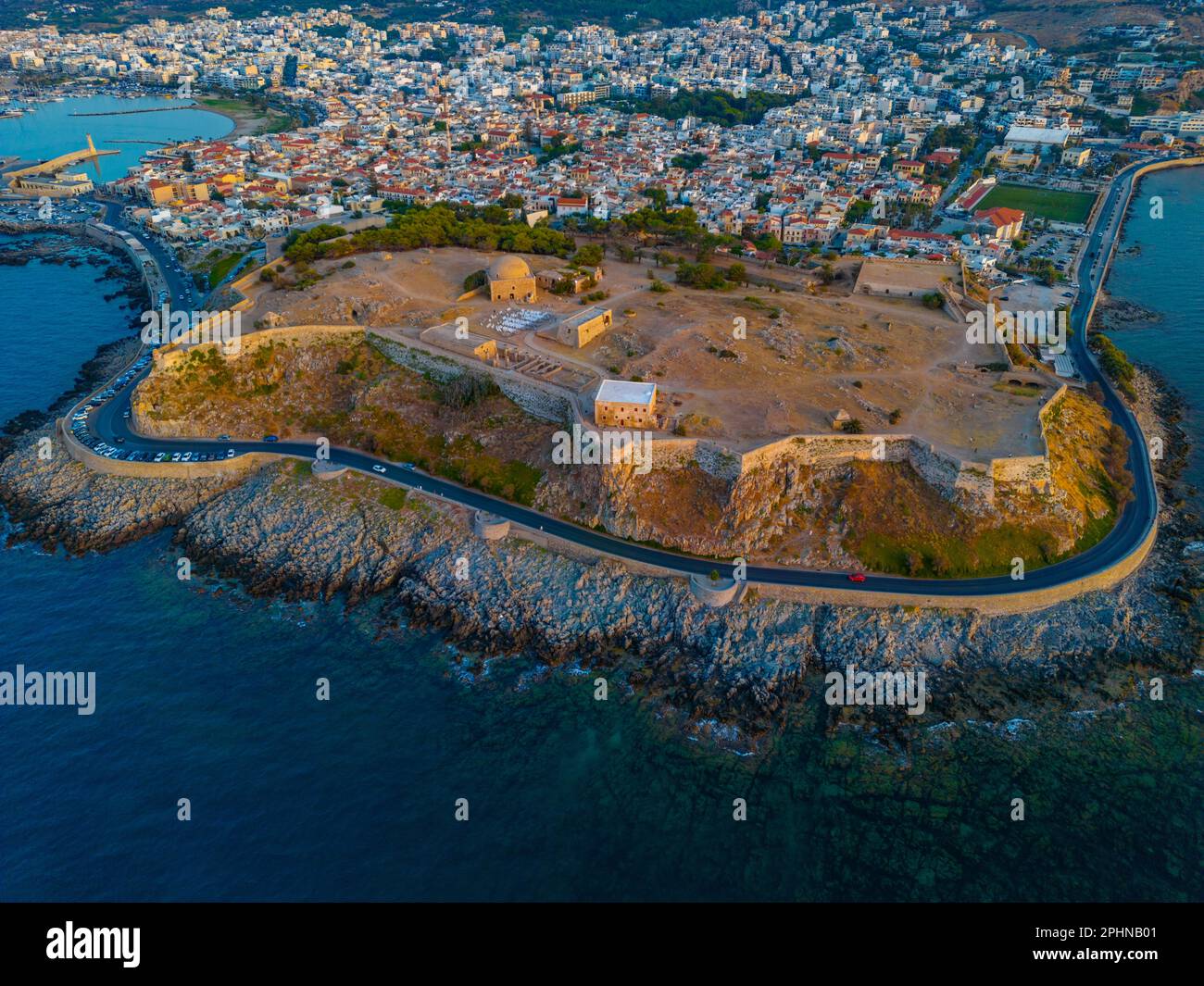 Sunset aerial view of Venetian Fortezza Castle in Greek town Rethimno ...