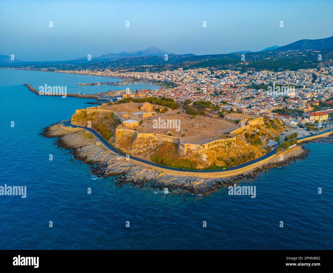 Sunset aerial view of Venetian Fortezza Castle in Greek town Rethimno ...