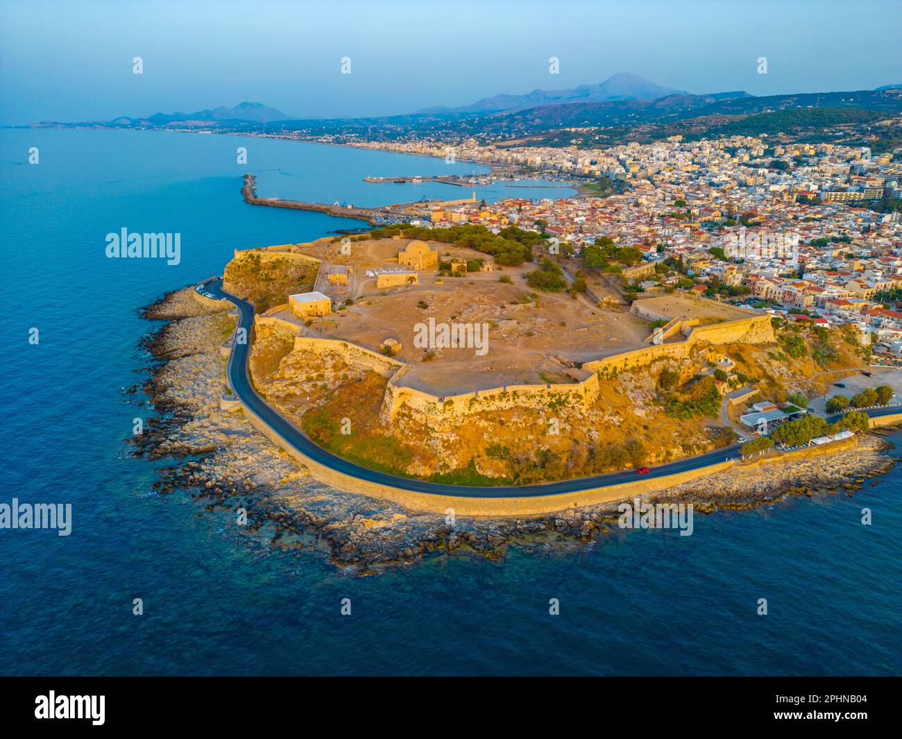 Sunset aerial view of Venetian Fortezza Castle in Greek town Rethimno ...
