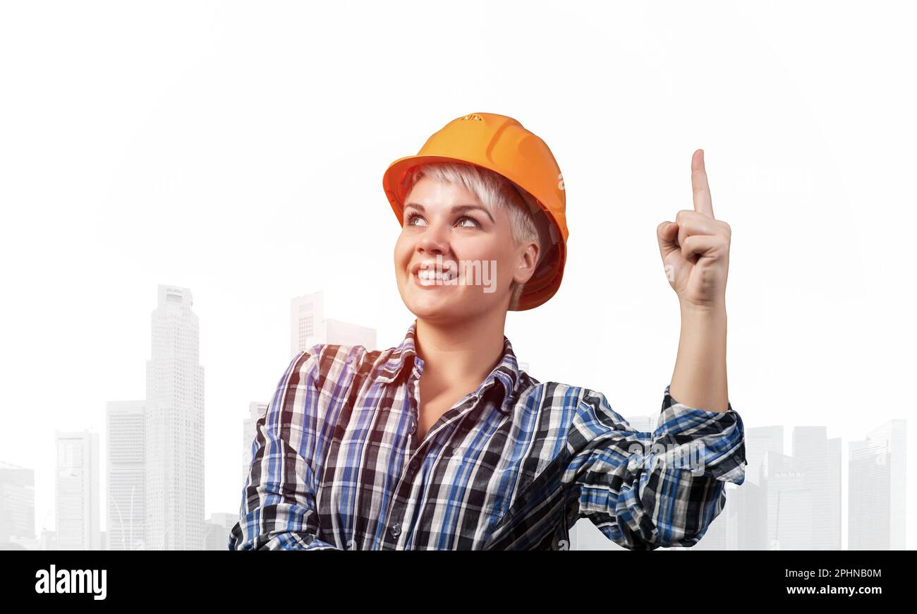 Beautiful female builder in hardhat Stock Photo - Alamy