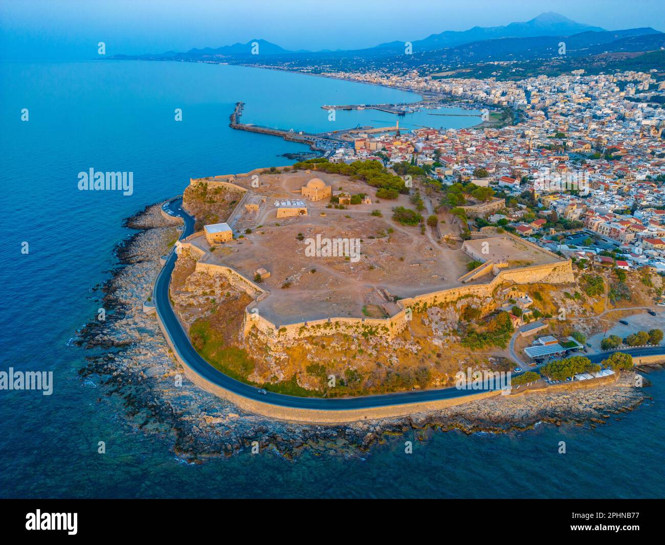 Sunset aerial view of Venetian Fortezza Castle in Greek town Rethimno ...