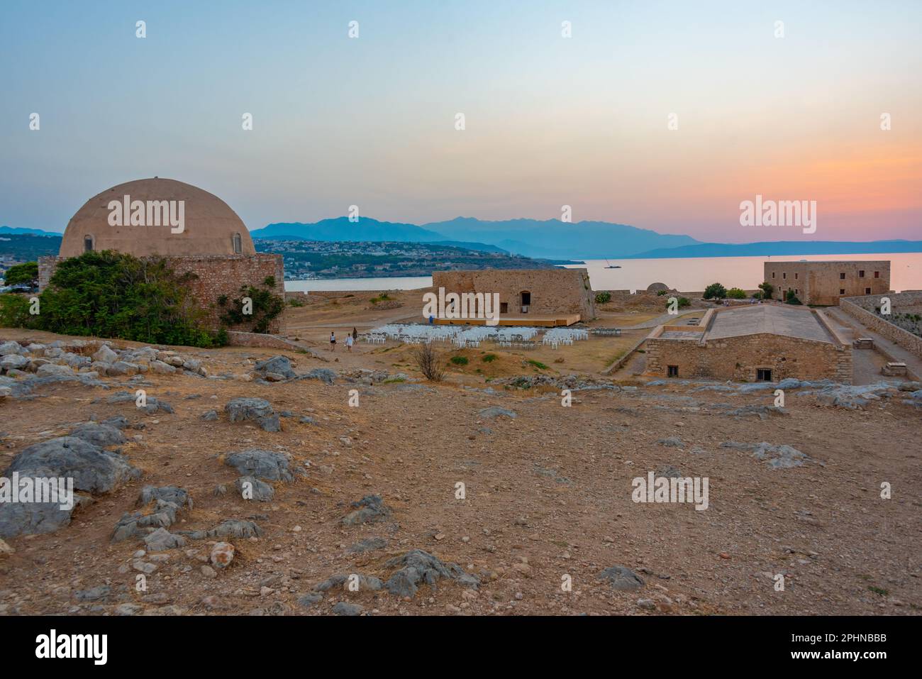 Sunset view of buildings at Venetian Fortezza Castle in Greek town ...