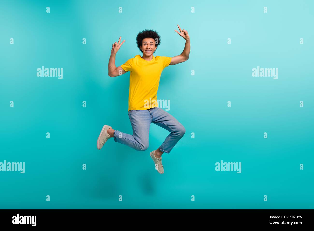 Full size photo of crazy active person jumping hands fingers show v ...