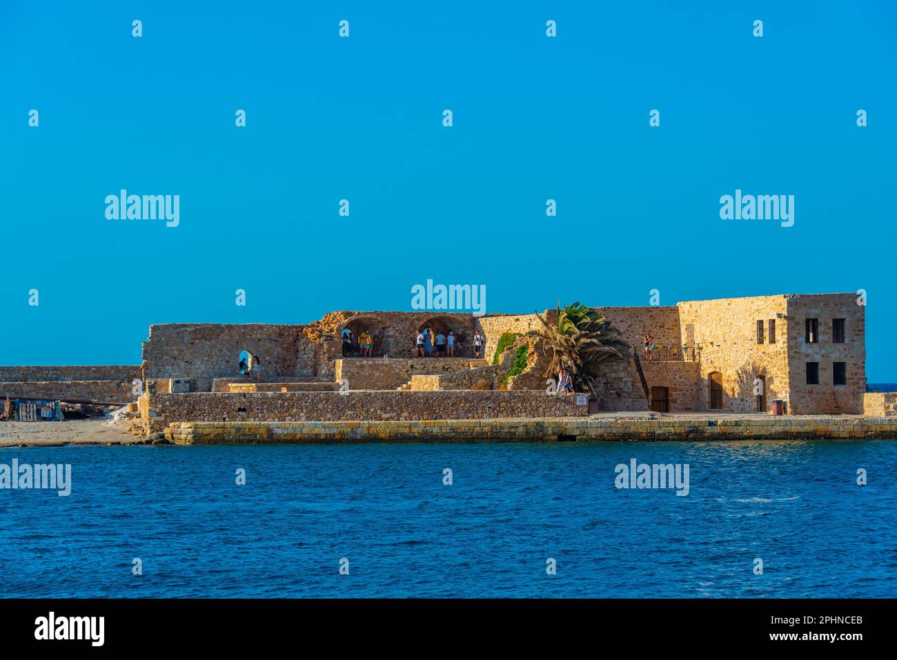 Historical building at a breakwater of Venetian port of Chania at Crete ...