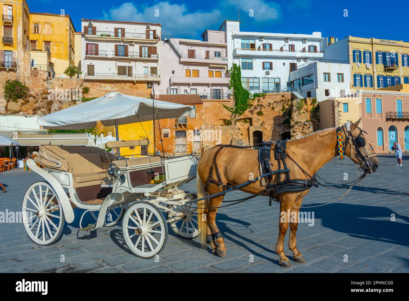 Horse carriage at the Venetian port of Chania in greece Stock Photo - Alamy