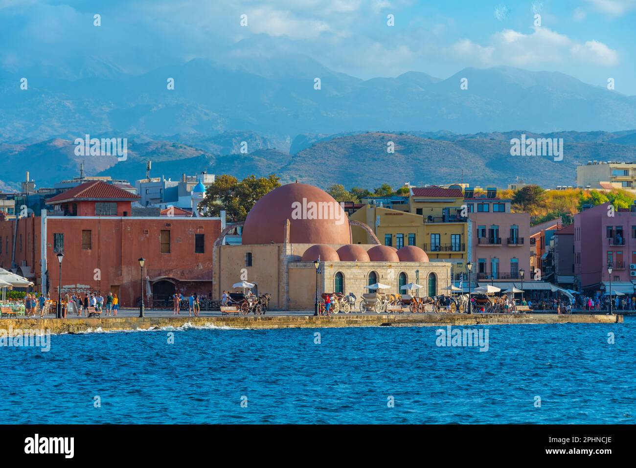 Old mosque at the seaside of old Venetian harbor at Greek town Chania ...