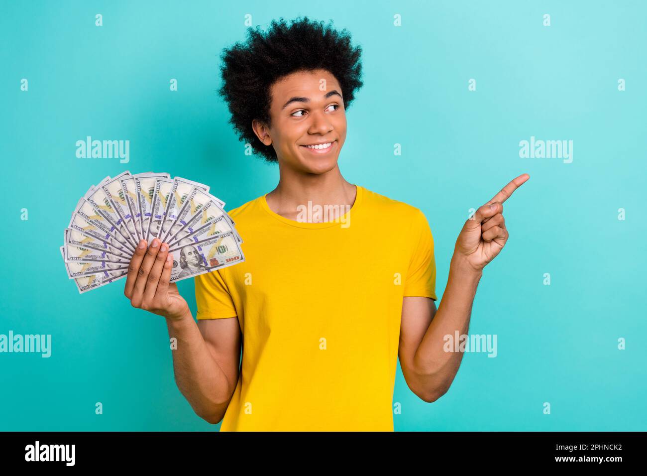 Photo of handsome guy hold dollar bills banknotes look direct finger ...