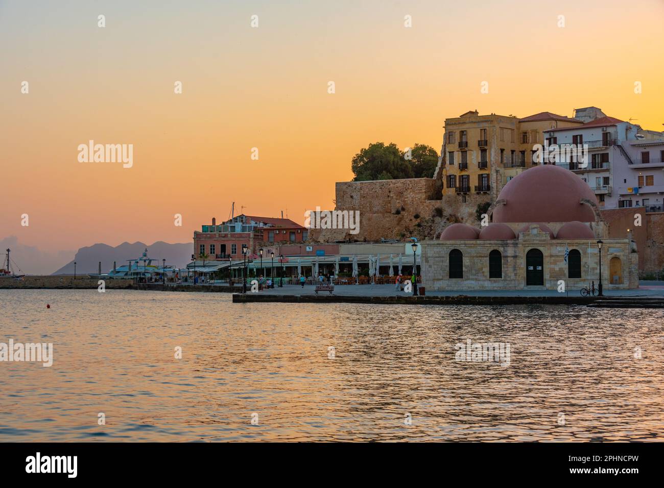 Sunrise view of Old mosque at the seaside of old Venetian harbor at ...