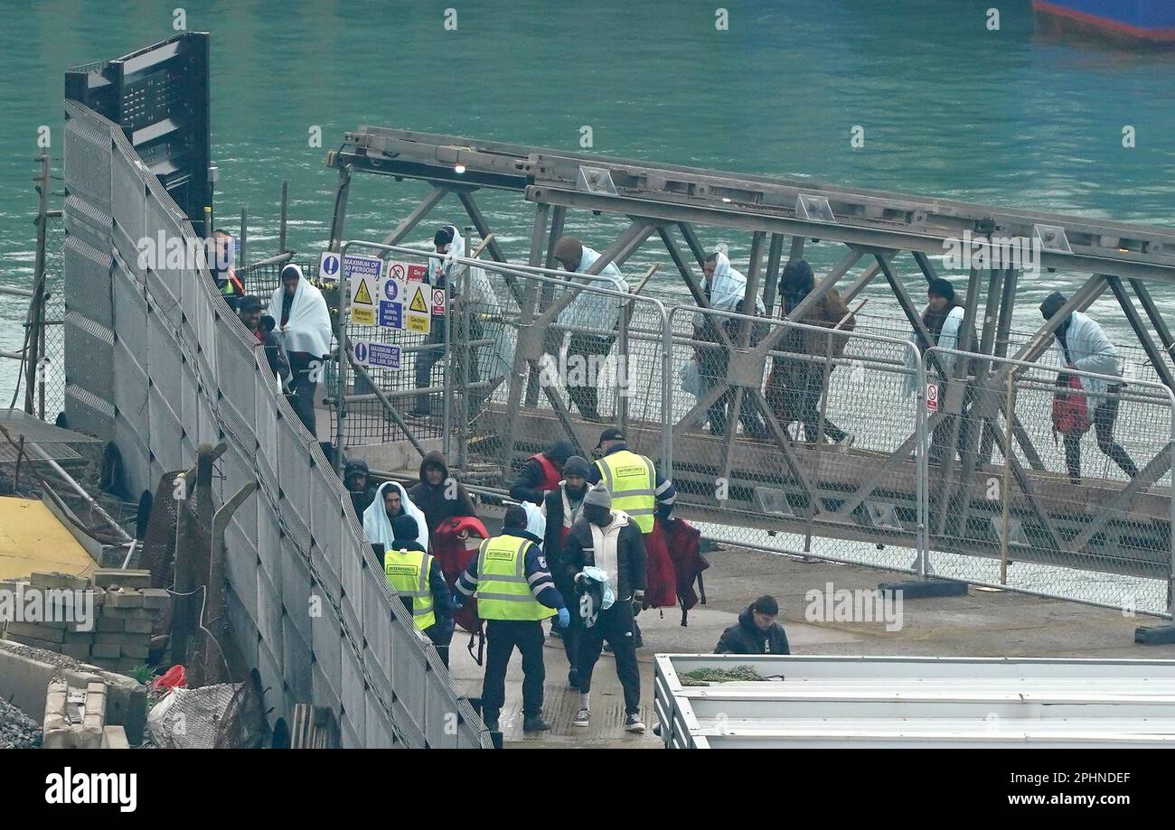 A group of people thought to be migrants are brought in to Dover, Kent ...