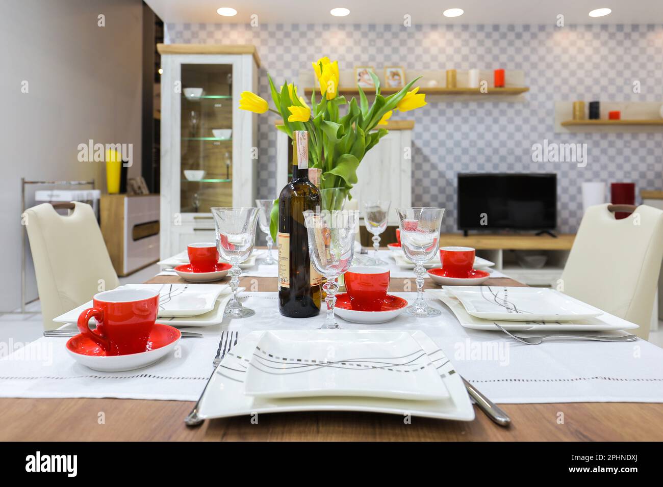 Cozy served table in home interior Stock Photo - Alamy
