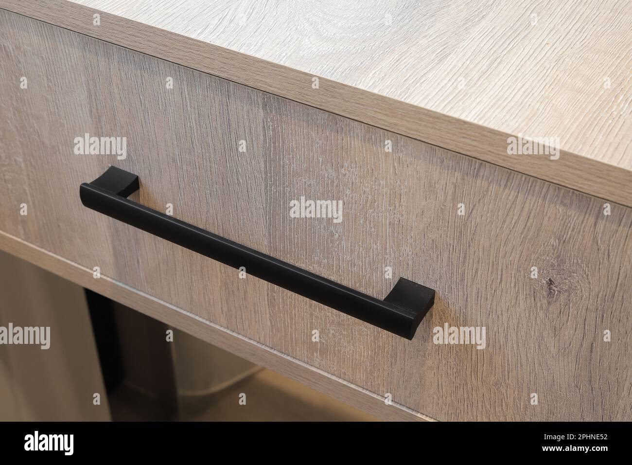Furniture drawer door handle black color Stock Photo - Alamy