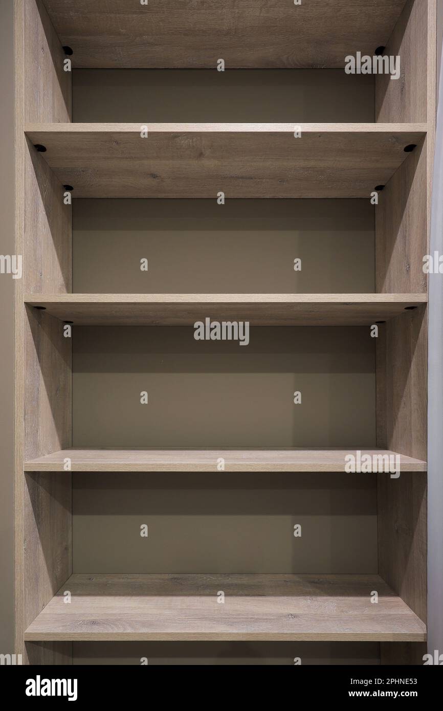 Empty wooden shelves on the wall Stock Photo - Alamy