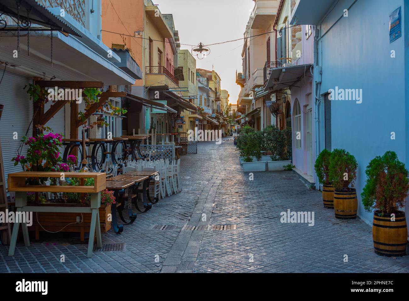 Sunrise view of a tourist street in Greek town Chania at Crete island ...