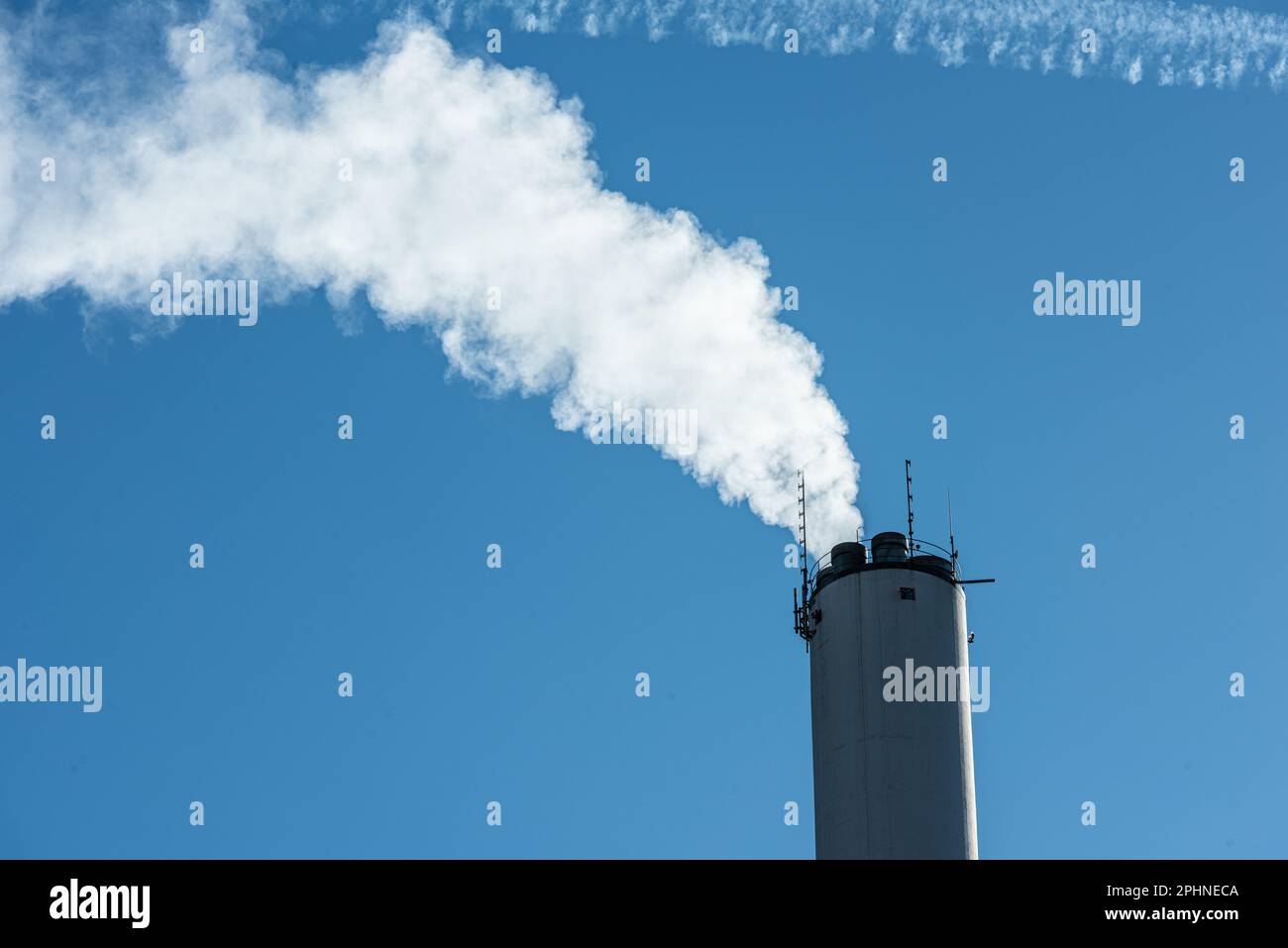 Steam rising from a tall chimney Stock Photo - Alamy