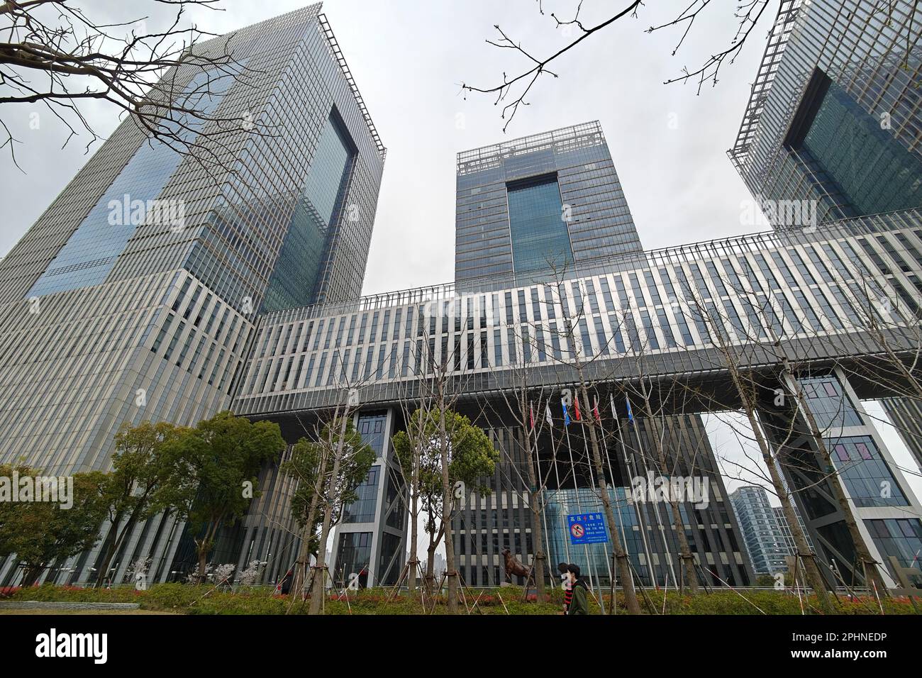 SHANGHAI, CHINA - MARCH 29, 2023 - Pedestrians pass the new building of ...