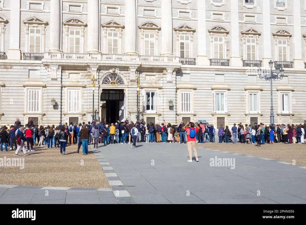 A large group of people and tourists watching the changing of the ...