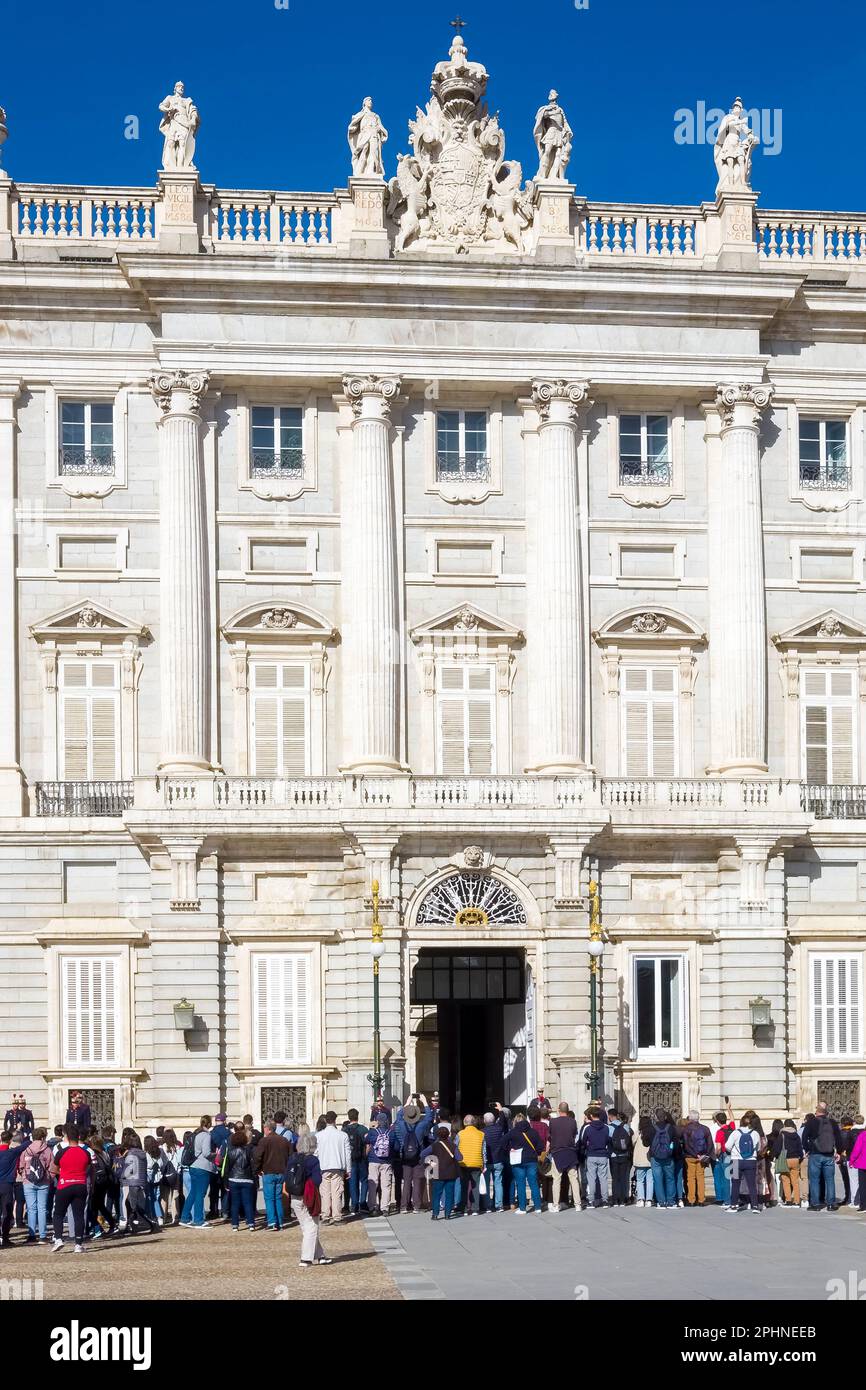 A large group of people and tourists watching the changing of the ...