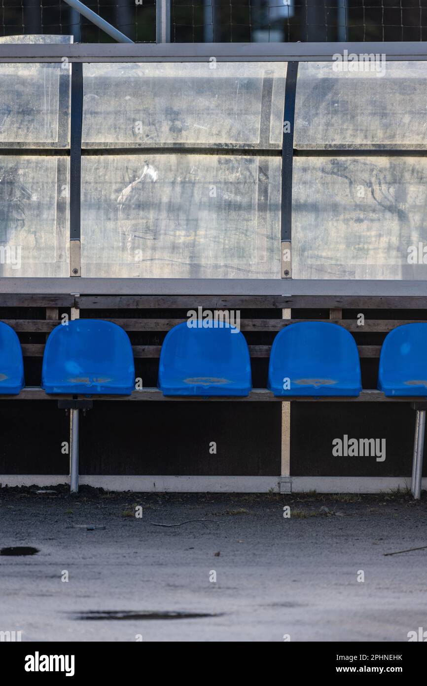 Blue plastic seats of a substitute bench Stock Photo - Alamy