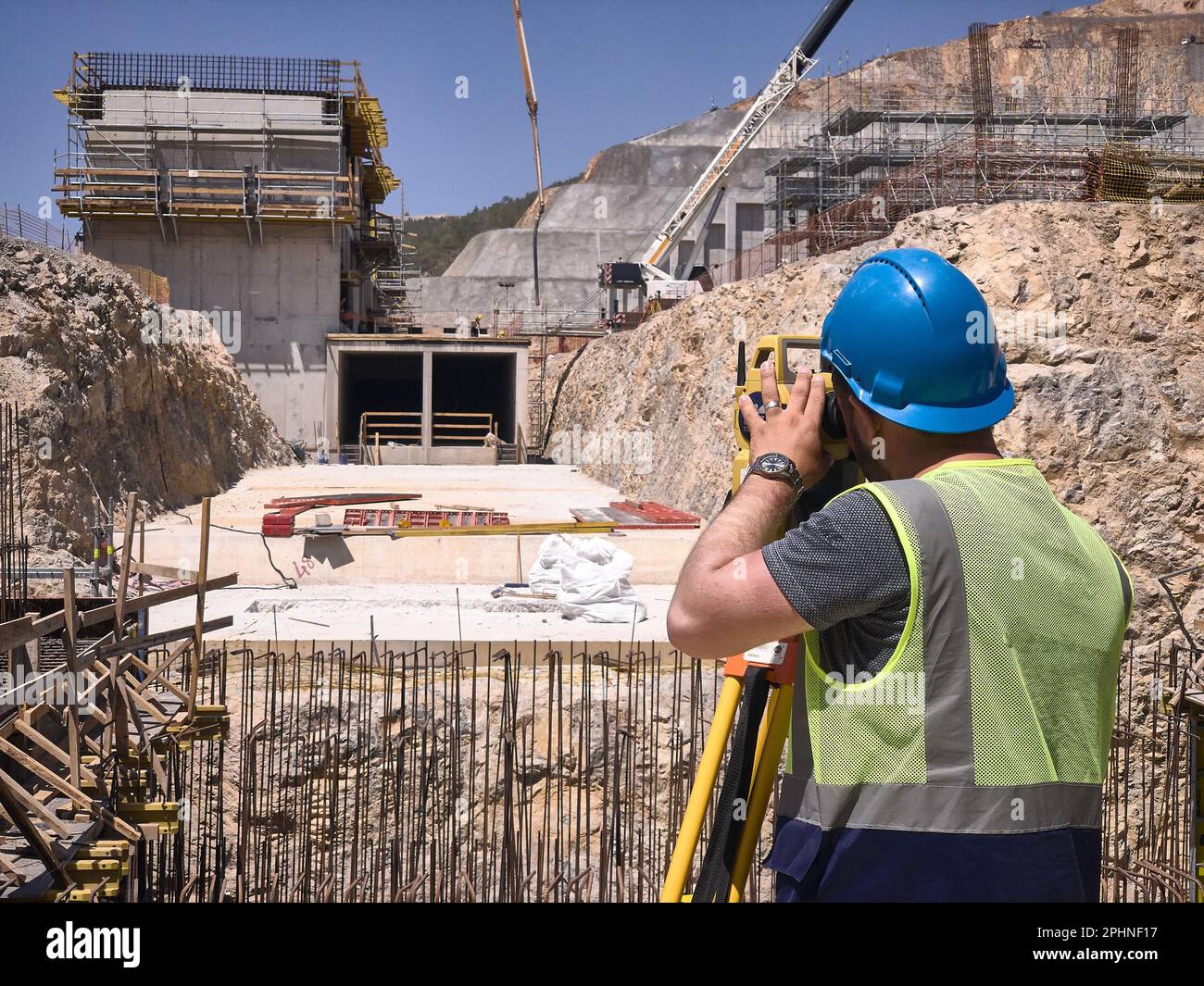 Land surveyor works at construction site Stock Photo - Alamy