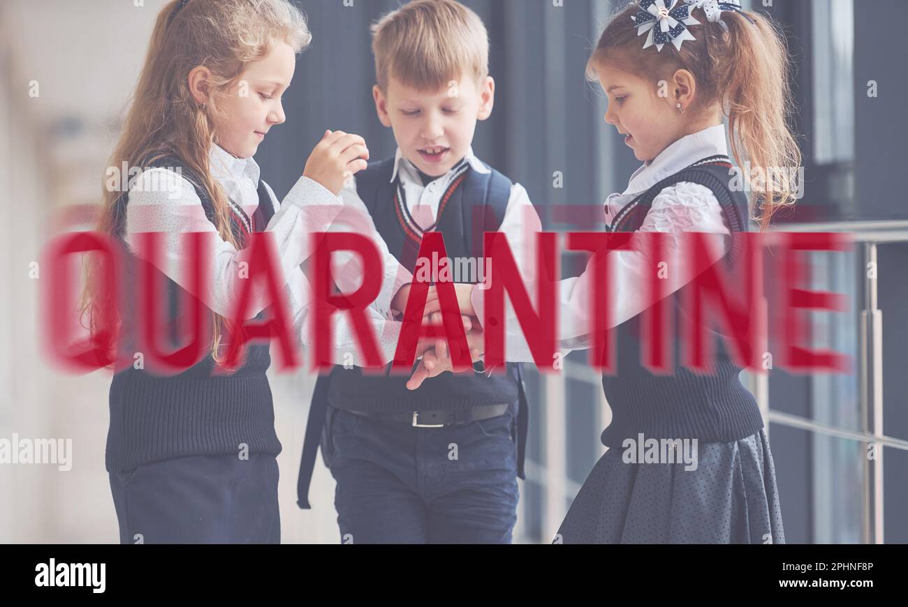 Red quarantine word. Group of kids in school uniform standing together ...