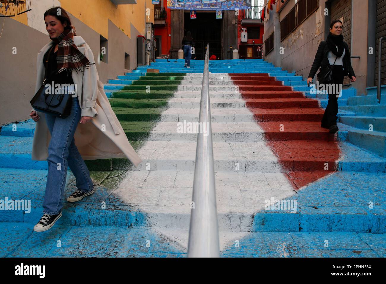 Naples, Italy. 29th Mar, 2023. Girls descend a staircase in the center ...