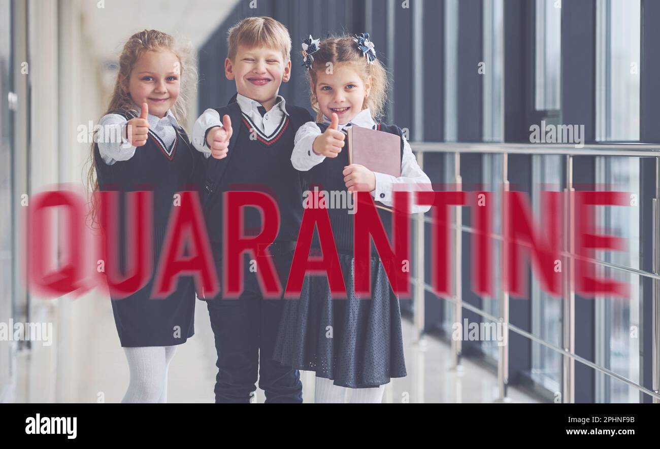 Red quarantine word. Group of kids in school uniform standing together ...