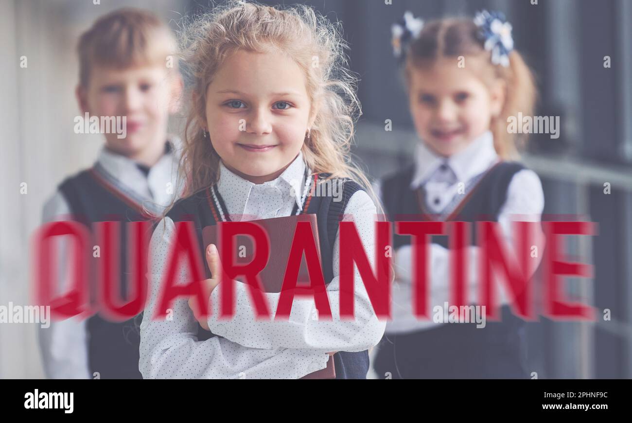 Red quarantine word. Group of kids in school uniform standing together ...